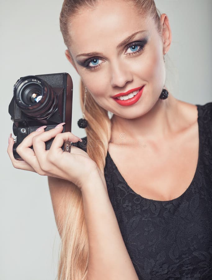 Beautiful Woman with Camera Stock Image - Image of fashion, hair: 46063145