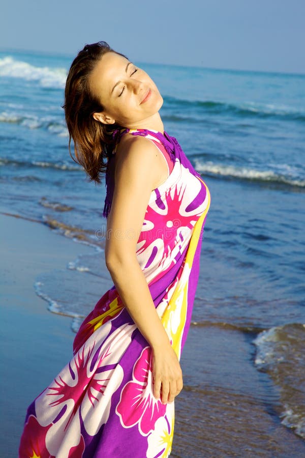 Beautiful Woman Caressed by the Sun on the Beach Stock Image - Image of ...