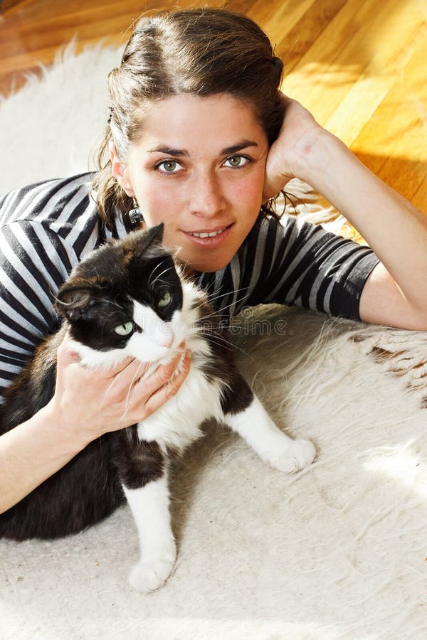 A woman and her cat stock photo. Image of feline, caretaker - 401218
