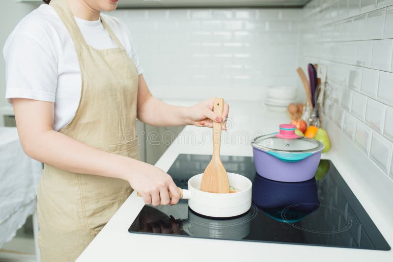 Beautiful Woman Cooking Something in the Kitchen Stock Photo - Image of ...