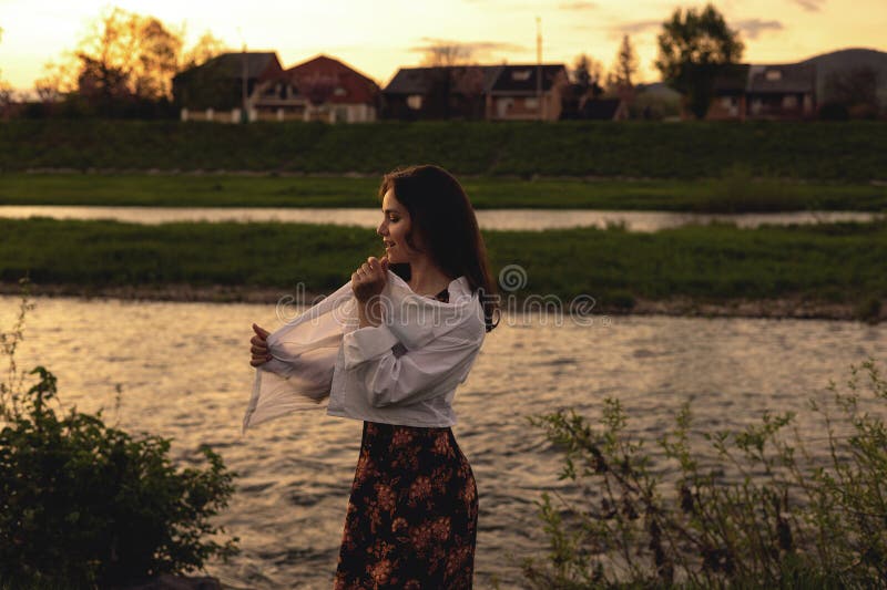 Woman dancing by the river stock image. Image of face - 378380957