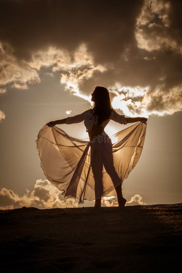 Beautiful Woman Dancing at Sunset Stock Photo - Image of girl, deserted ...