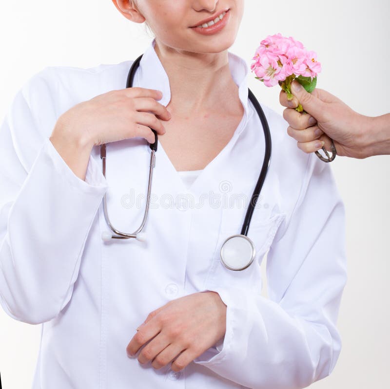 Beautiful Woman Doctor with a Flower. Stock Photo - Image of present ...