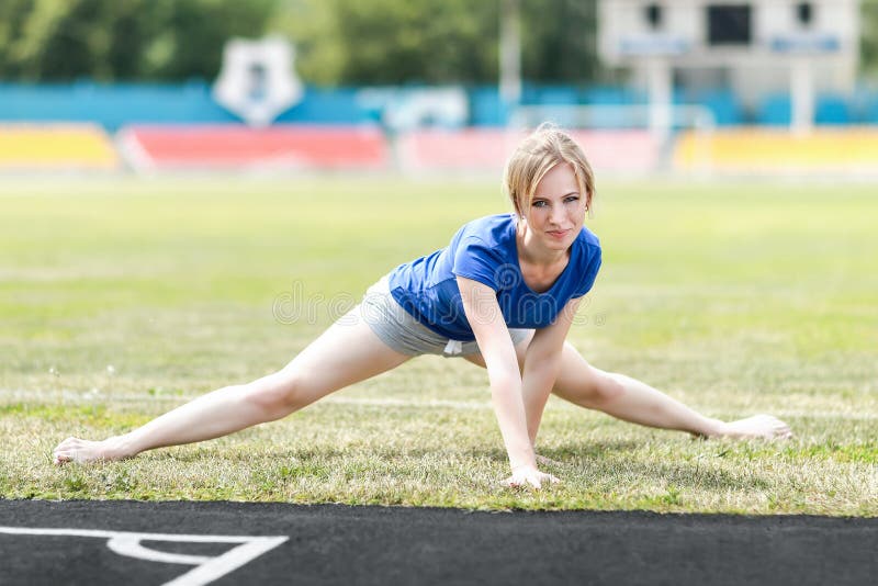 Beautiful Woman Doing Core Workout at a Stadium Stock Image - Image of ...