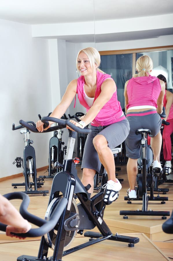 Beautiful Woman Doing Exercise in a Spinning Class Stock Image - Image ...