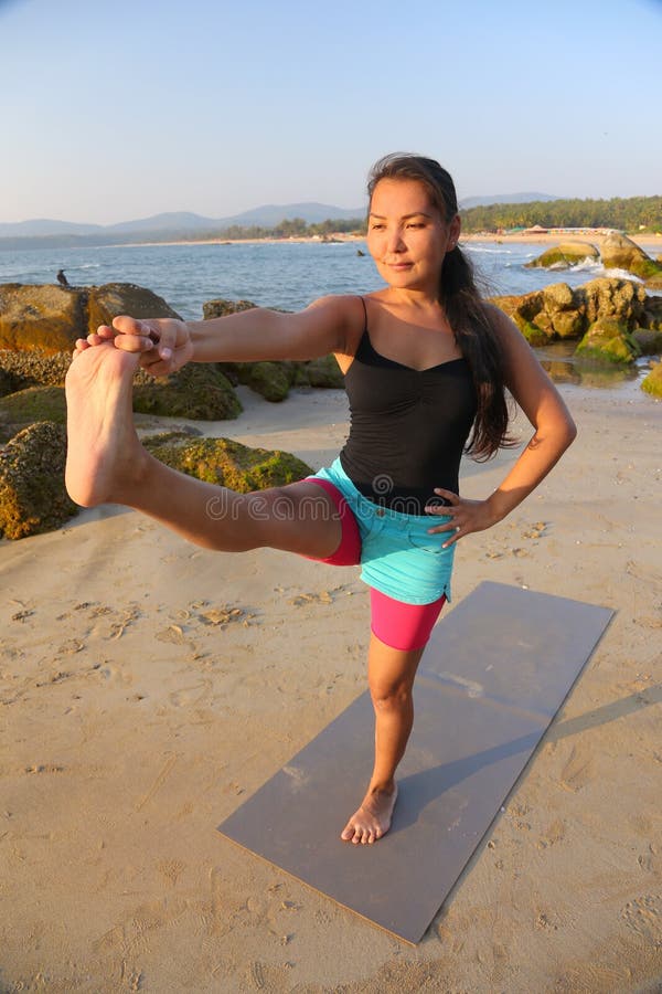 Beautiful woman doing yoga stock photo. Image of asian - 53553848