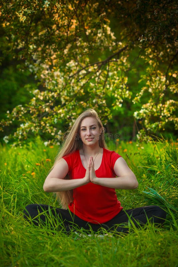 Beautiful Woman Doing Yoga Outdoors on Green Grass Stock Photo - Image ...