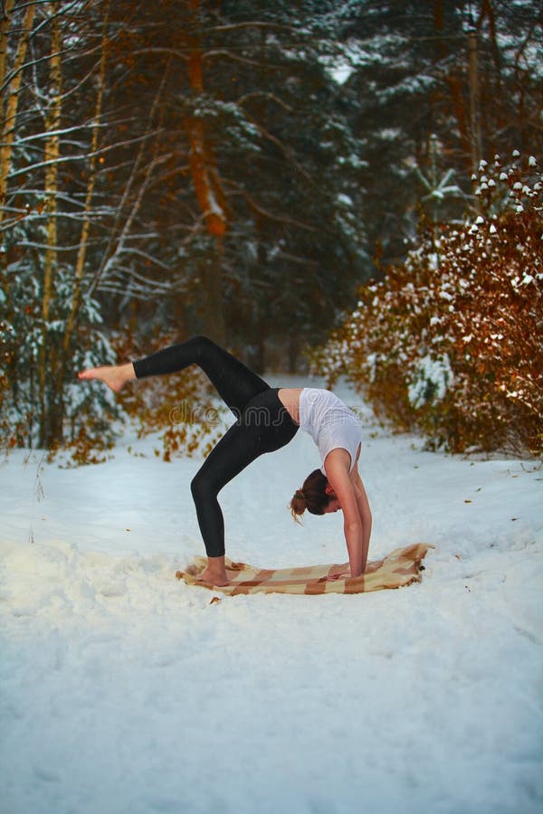 Beautiful Woman Doing Yoga Outdoors in Snow Stock Photo - Image of ...