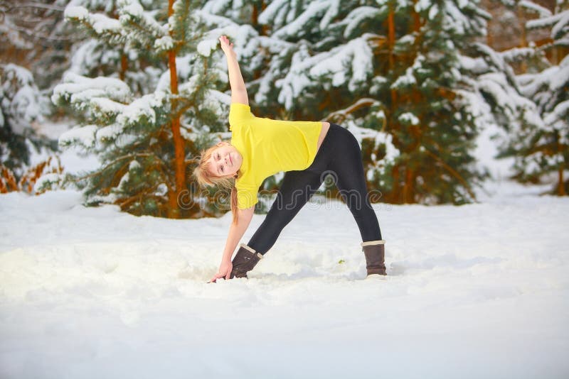 Beautiful Woman Doing Yoga Outdoors in Snow Stock Photo - Image of ...