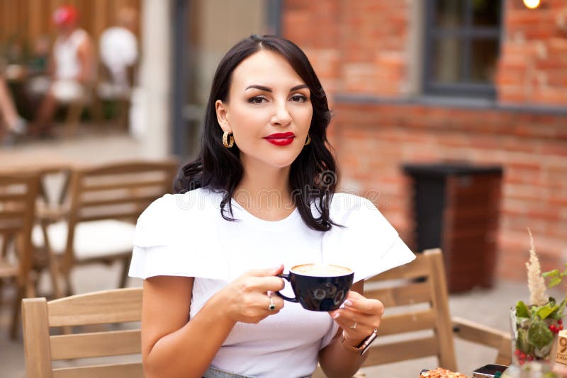 Beautiful Woman Drinking Coffee in a Cafe Stock Photo - Image of alone ...