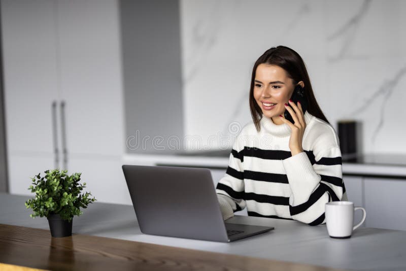 Beautiful Woman Drinking Coffee and Talk Phone in the Kitchen. Young ...