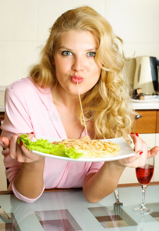 Beautiful Woman Eating Spaghetti Stock Photo - Image of house ...