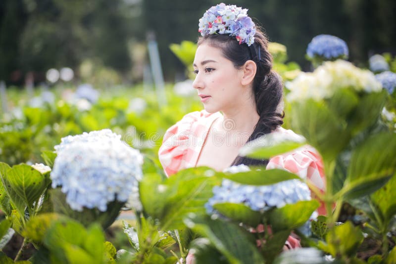 Beautiful Woman in the Flower Garden Stock Photo - Image of green ...