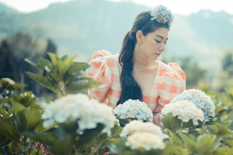 Beautiful Woman in the Flower Garden Stock Photo - Image of entering ...