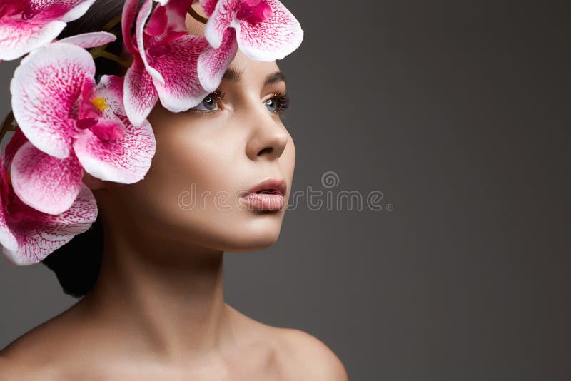 Beautiful Woman And Flowers Beauty Portrait Of Girl With Orchid Flowe