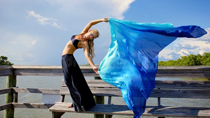 Beautiful Woman with Flowing Cloth Stock Photo - Image of bronzed, dock ...
