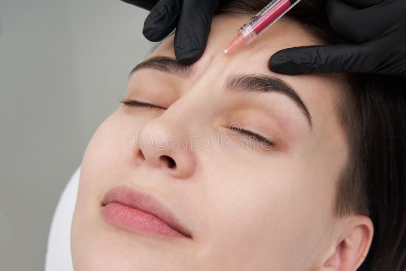 Beautiful Woman Gets an Injection in Her Face Stock Photo - Image of ...