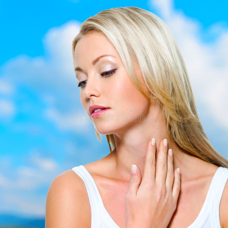 Beautiful Woman with Hand on Neck Stock Photo - Image of woman, face ...