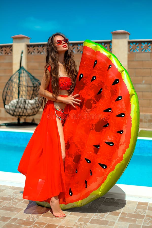 Beautiful Woman Having Fun With Watermelon Float Mattress By Swimming
