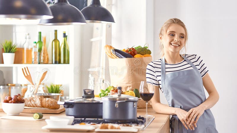 Beautiful Woman in Kitchen is Drinking Red Wine Stock Image - Image of ...