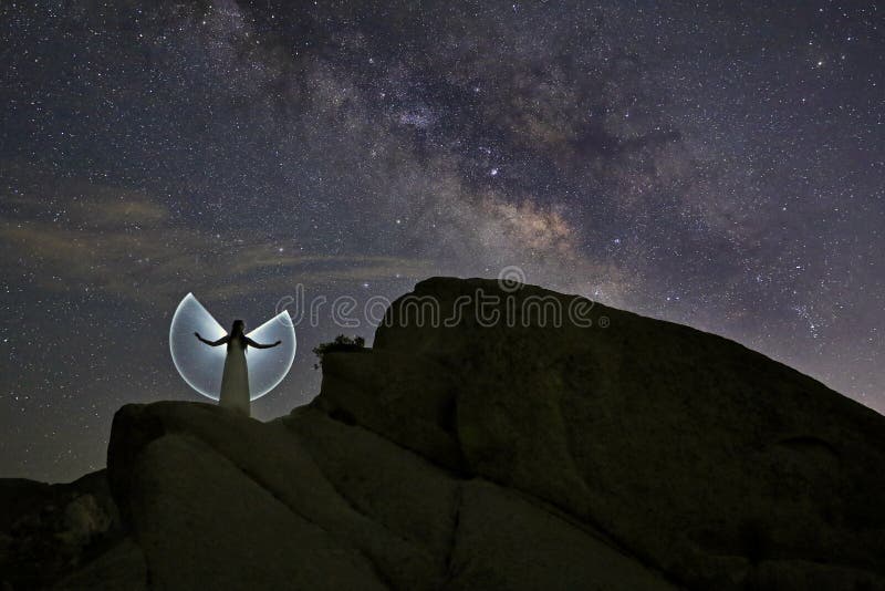Beautiful Woman Light Painted with the Night Sky Posing Stock Image ...