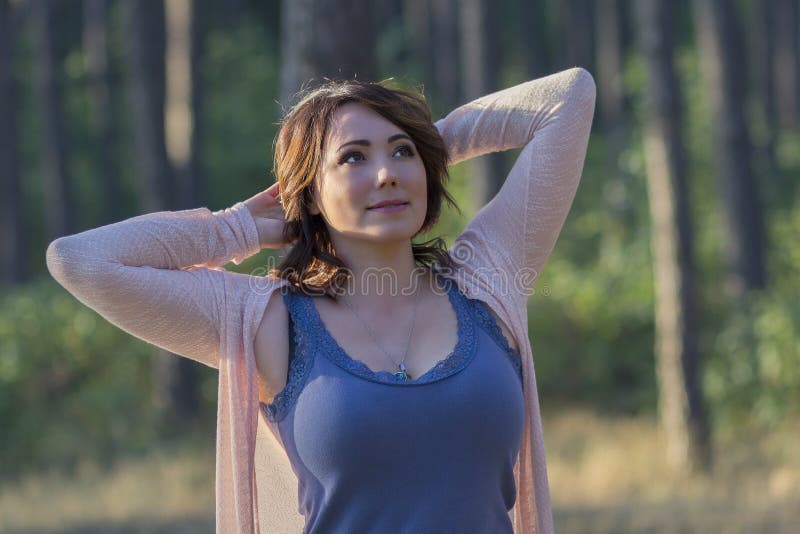 Beautiful Woman Lit by the Sun in the Park Stock Photo - Image of ...