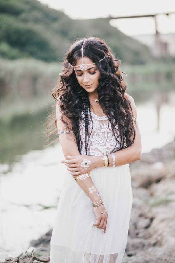 Beautiful Woman With Long Curly Hair Dressed In Boho Style Dress Posing
