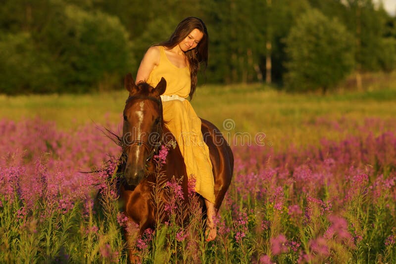 Beautiful Woman with Long Hair in Yellow Dress Riding Bareback a Brown ... Beautiful Woman with Long Hair in Yellow Dress Riding Bareback a Brown ...