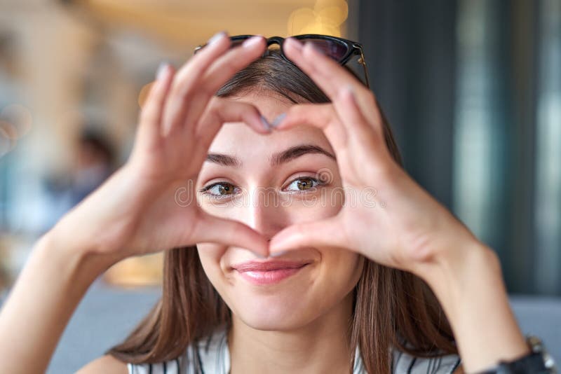 Beautiful Woman Looking through Heart Gesture Made with Hands Stock ...
