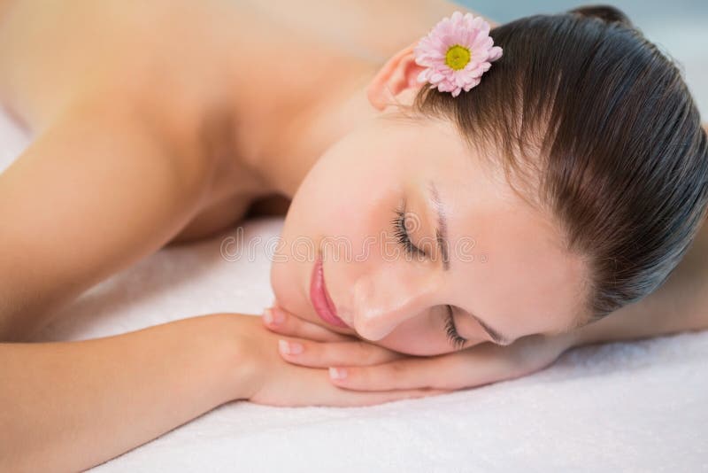 Beautiful Woman Lying On Massage Table At Spa Center Stock Image