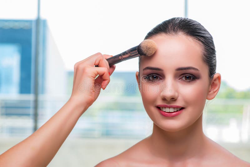 The Beautiful Woman during Make-up Cosmetics Session Stock Photo ...