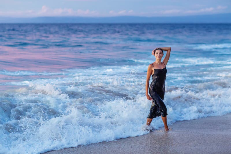 Beautiful Woman by the Ocean at Sunset Stock Photo - Image of happy ...