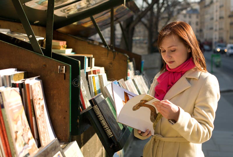 Beautiful Woman in Paris Selecting a Book Editorial Stock Image - Image ...