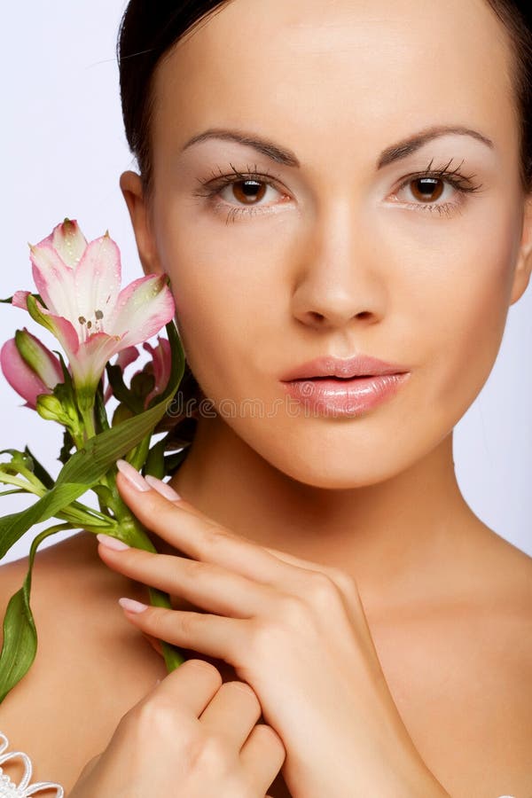 Beautiful Woman with Pink Flower Stock Photo - Image of healthy, face ...