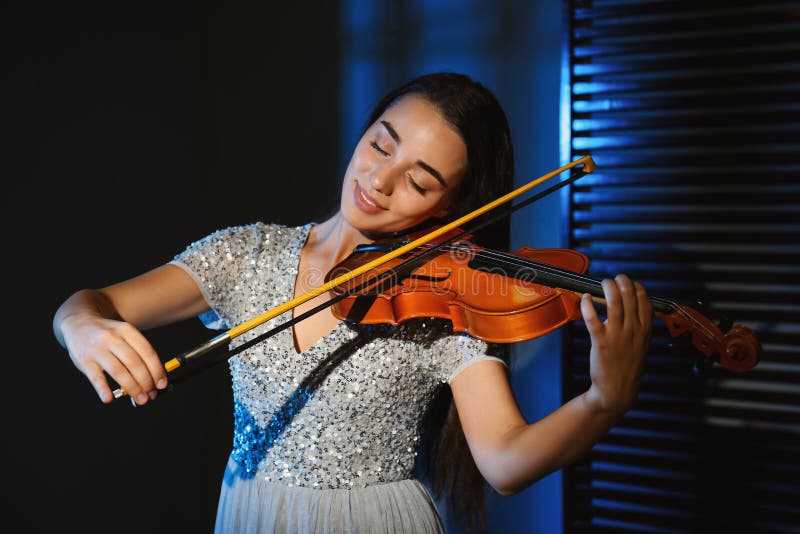 Beautiful Young Woman Playing Violin in Dark Room Stock Image - Image ...