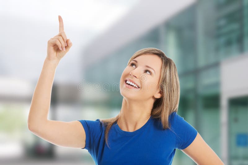 Beautiful Woman Pointing Somewhere Stock Image - Image of smile, modern ...
