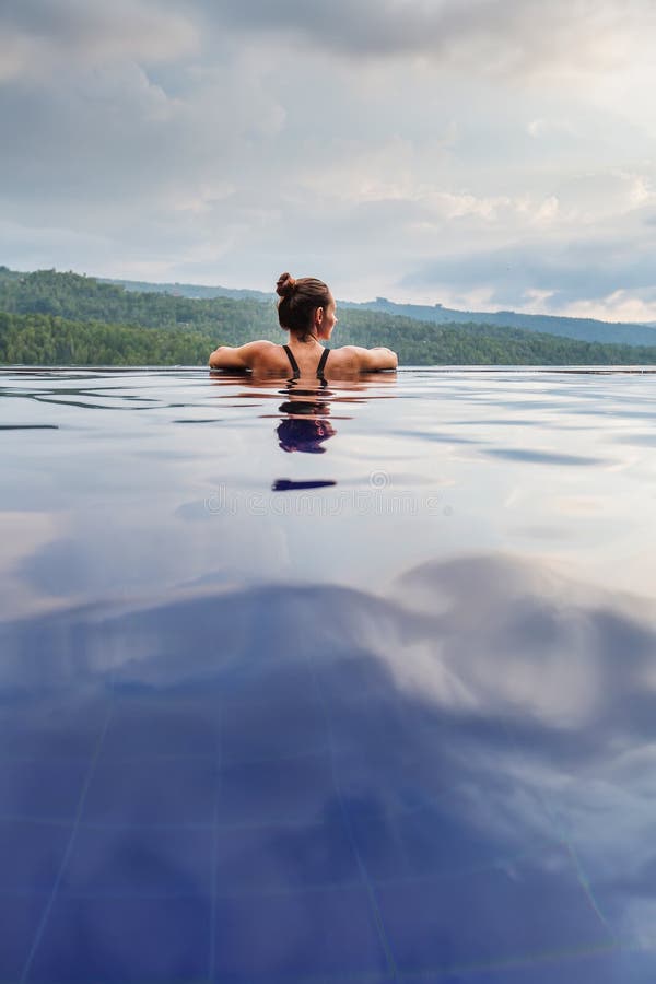 Beautiful Woman by the Pool Stock Image - Image of bali, pool: 158010131