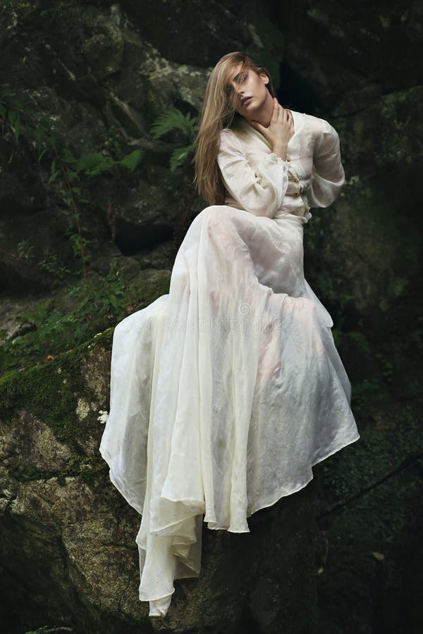 Beautiful Woman Posing on Moss Stock Photo - Image of magic ...