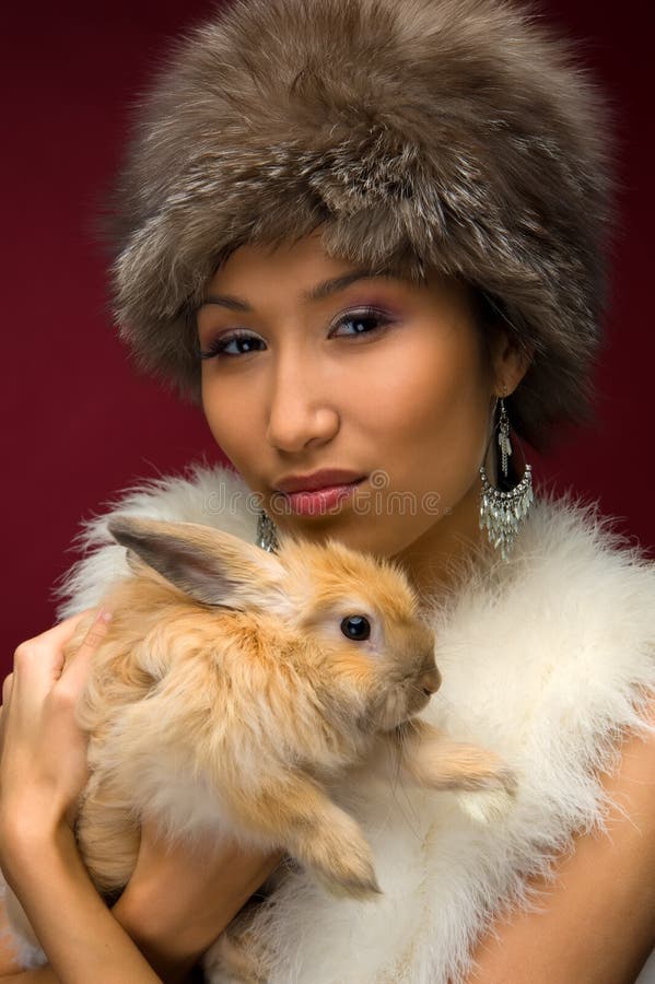 Beautiful Woman with Rabbit Stock Photo - Image of attractive, piebald ...
