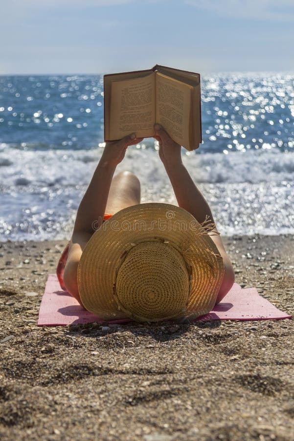 Beautiful Woman Reading on Beach Stock Image - Image of blue, summer ...