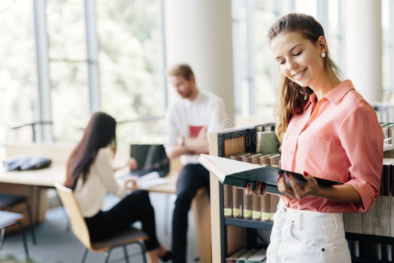 Beautiful Woman Reading a Book in a Library Stock Image - Image of ...