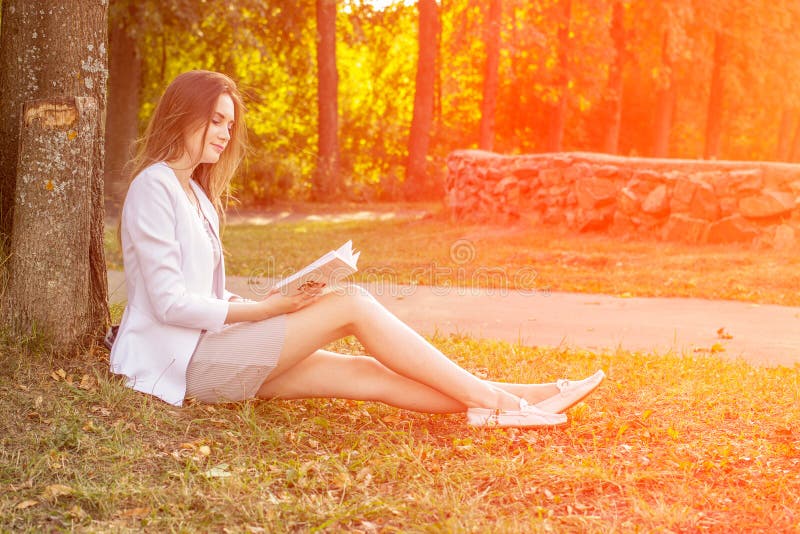 Beautiful Woman Reading a Book at the Park Stock Photo - Image of book ...