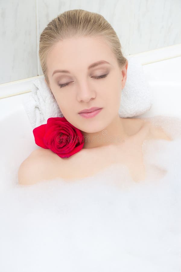 Beautiful Woman Relaxing in Bath with Red Flower Stock Photo - Image of ...