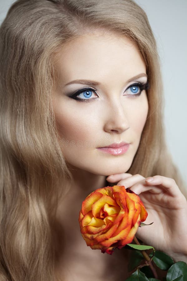 Beautiful Woman with a Rose Stock Photo - Image of pretty, people: 23429406