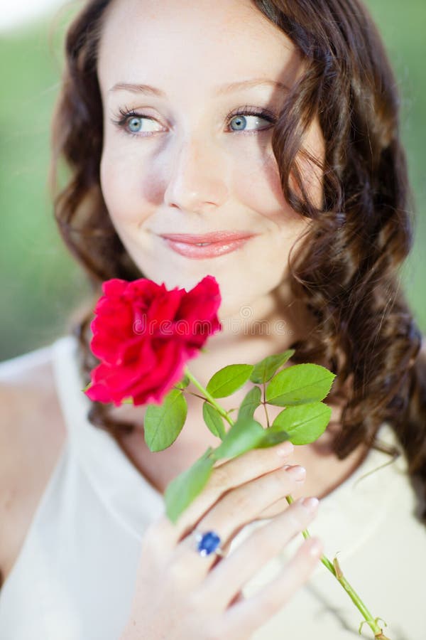 Beautiful Woman with a Rose Stock Photo - Image of smelling, flirting ...
