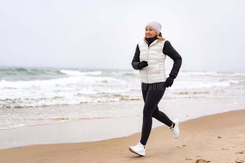 Beautiful Woman Running on Beach Stock Image - Image of jogger, coast ...