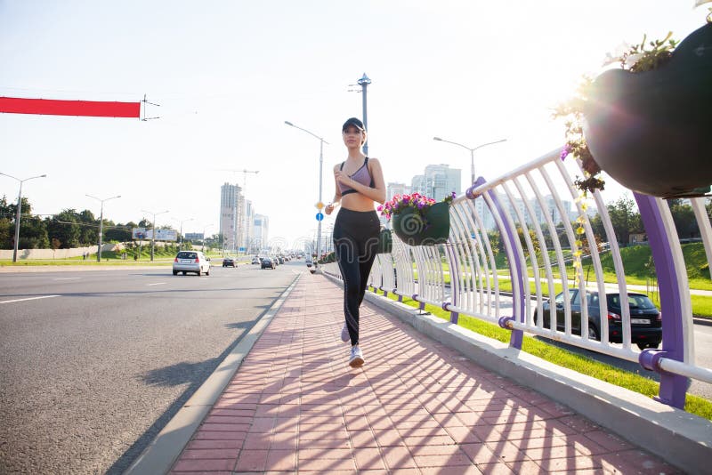 Beautiful Woman Running Over Bridge during Sunset. Stock Image - Image ...