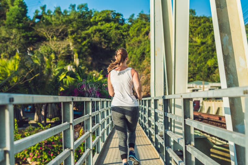 Beautiful Woman Running Over Bridge during Sunset Stock Image - Image ...
