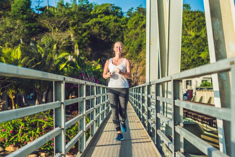 Beautiful Woman Running Over Bridge during Sunset Stock Photo - Image ...