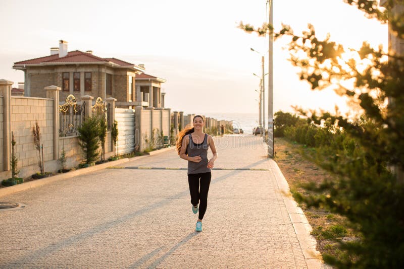 Beautiful Woman Running at Sunset. Stock Image - Image of lifestyle ...